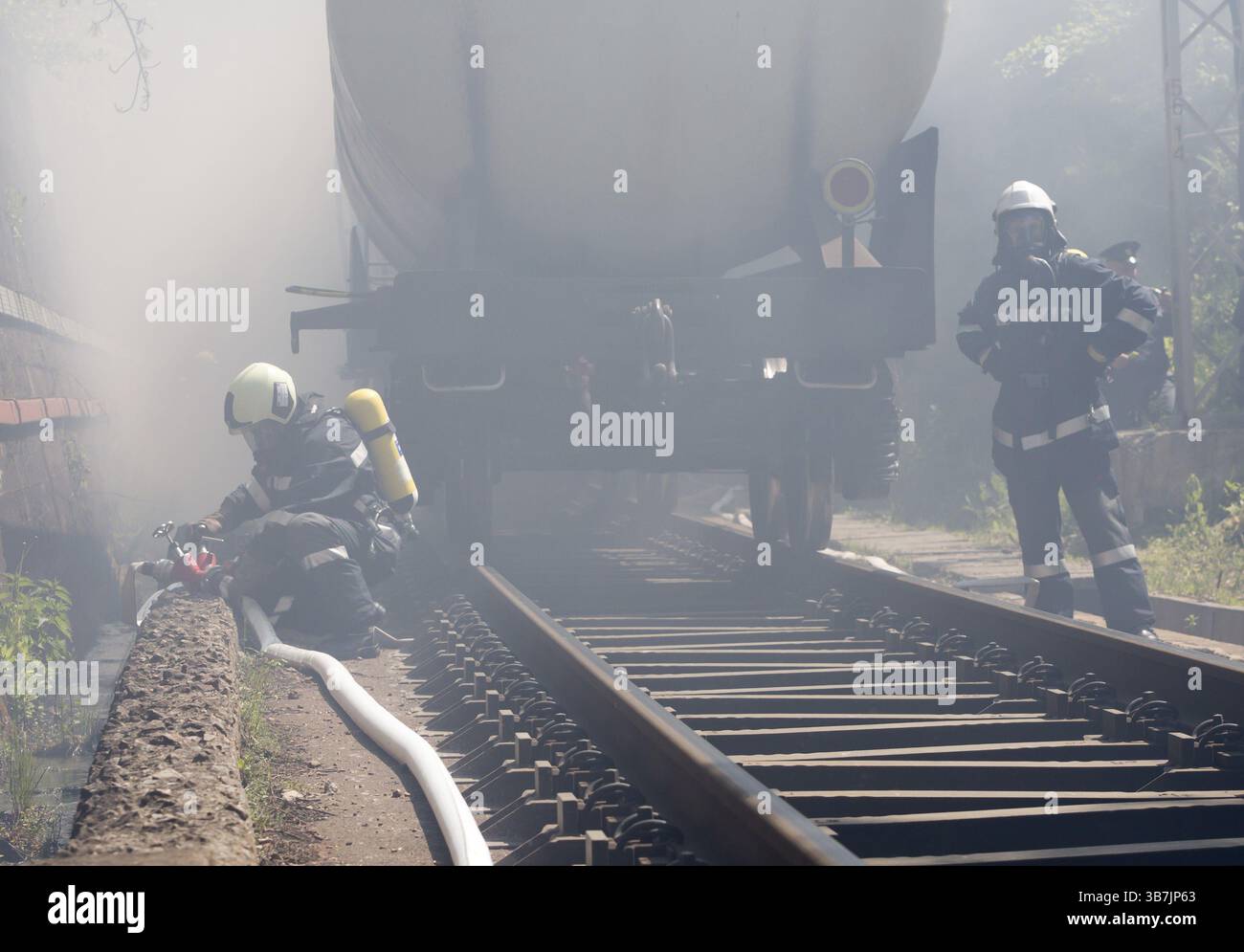 Sofia, Bulgaria - May 19, 2015: Firefighters are extinguishing chemical ...