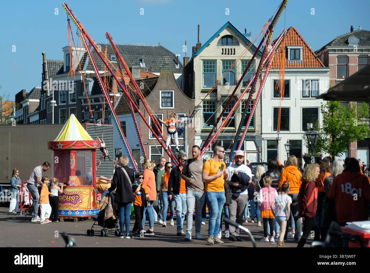 People visit a kermis, an outdoor fair, during the King's Day ...