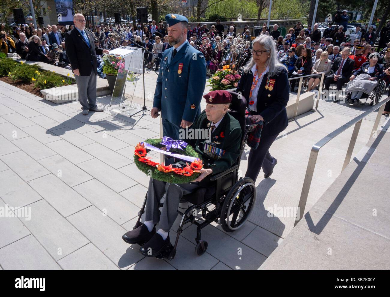 Veteran Christopher Snider prepares to lay a wreath to commemorate the ...