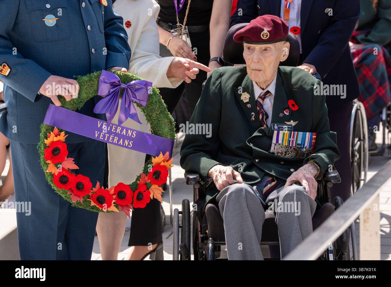 Veteran Christopher Snider prepares to lay a wreath to commemorate the ...