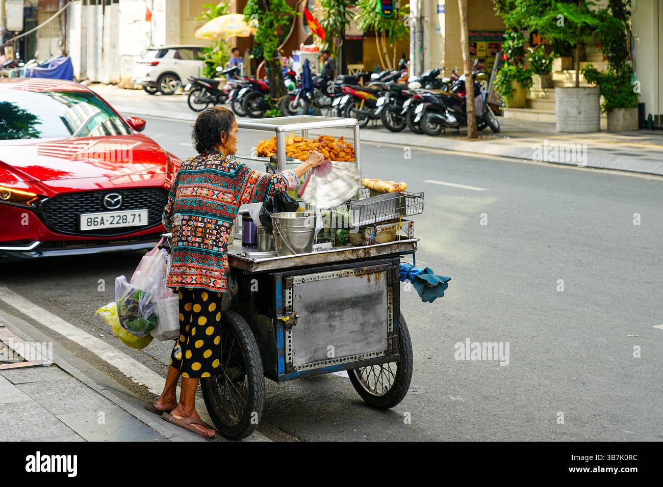 Ho Chi Minh City, Vietnam - March 16, 2025: Traditional street fast ...