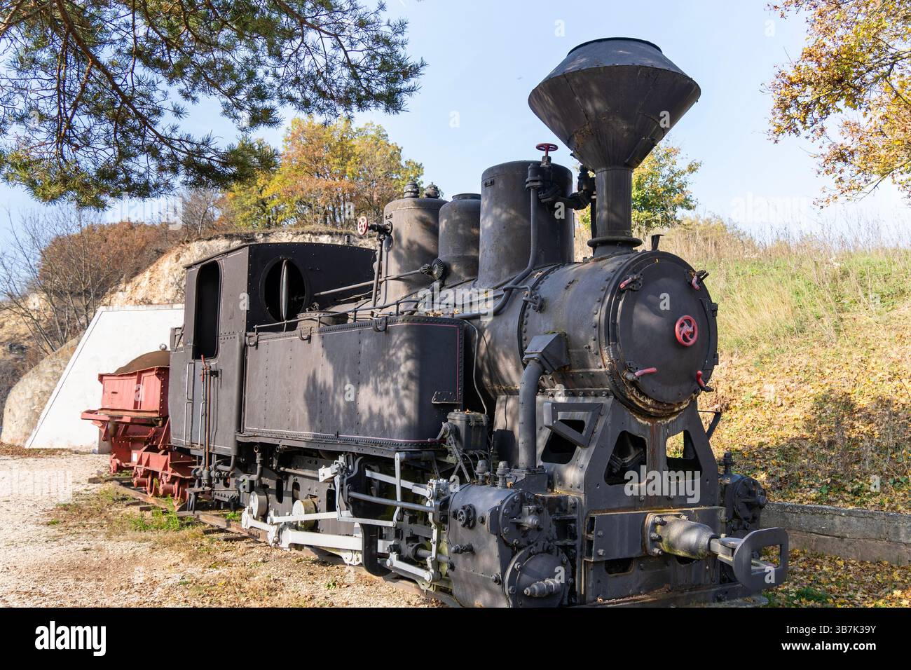 Vintage black steam locomotive in front of a mine entrance Stock Photo ...