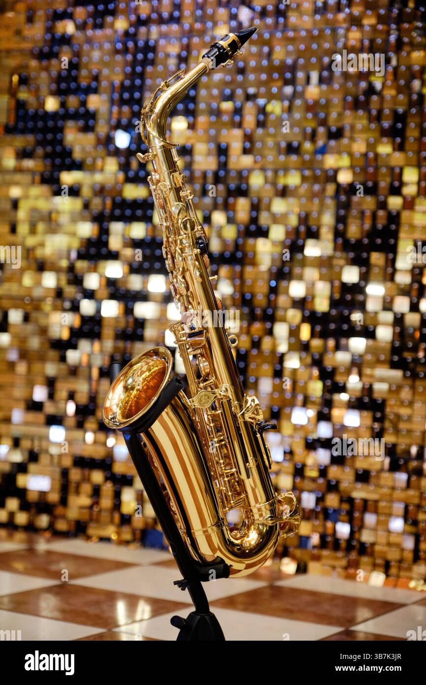 Elegant image of a shiny saxophone against a sparkling background ...