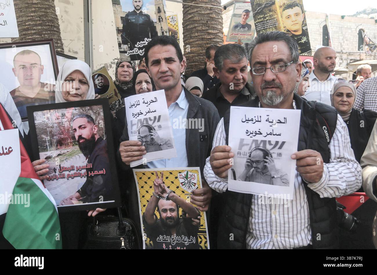 Nablus, Palestine. 06th May, 2025. Journalists hold up pictures and ...
