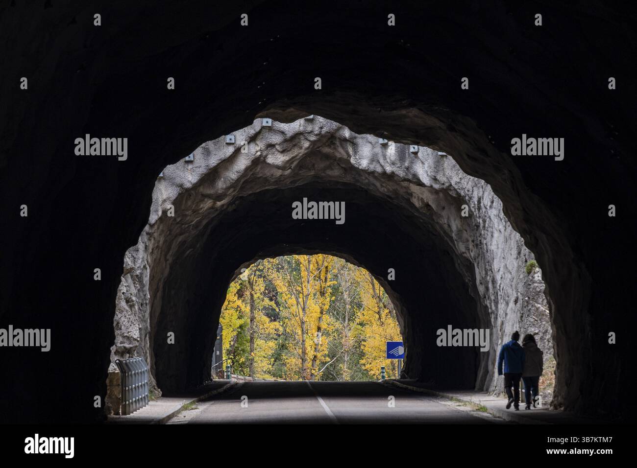 Two people in the tunnel, Yecla gorge, Santo Domingo de Silos, Burgos ...