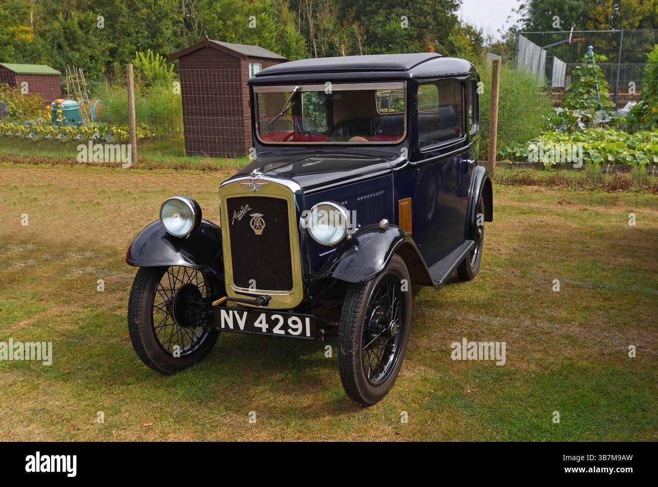 Vintage 1934 Austin Seven motor car parked in front of allotments Stock ...