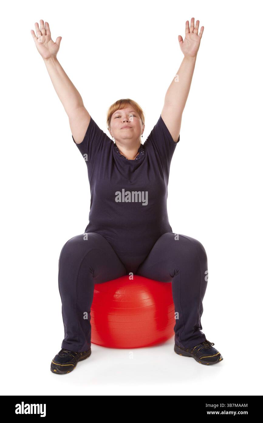 Fat woman with big red gimnastic ball Stock Photo - Alamy