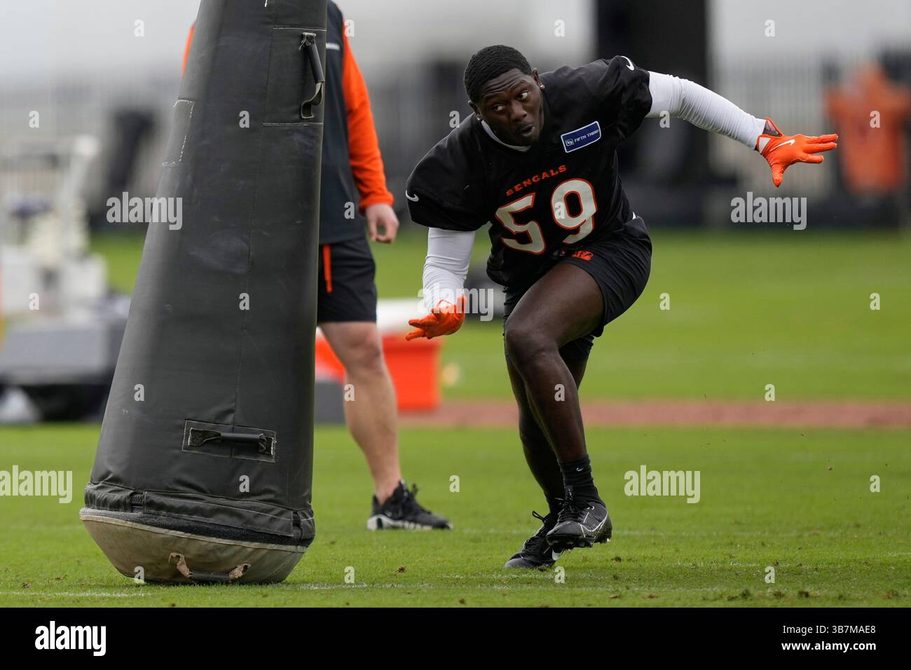 Cincinnati Bengals linebacker Craig Young (59) runs a drill during NFL ...