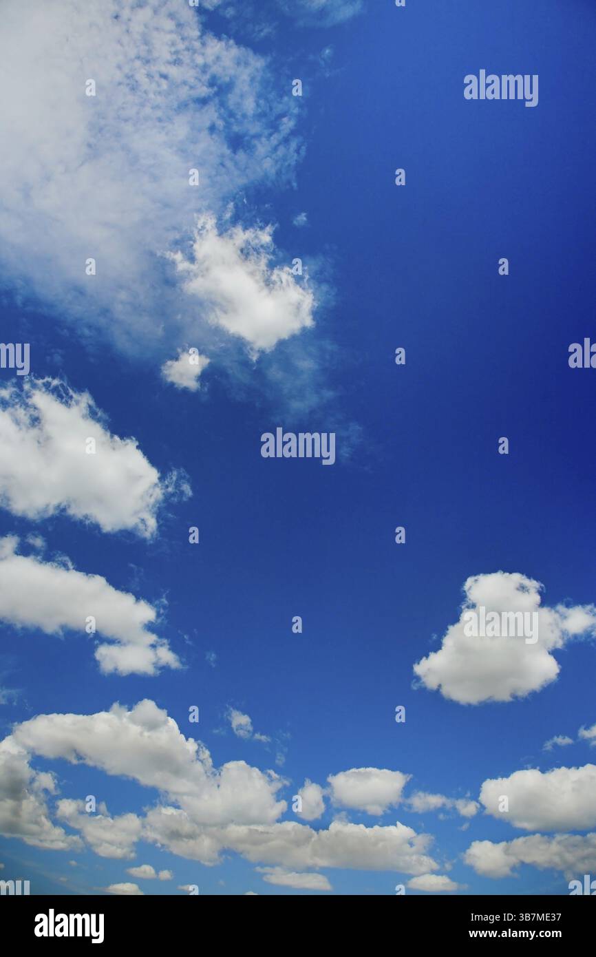 Clean blue sky background with white clouds Stock Photo - Alamy