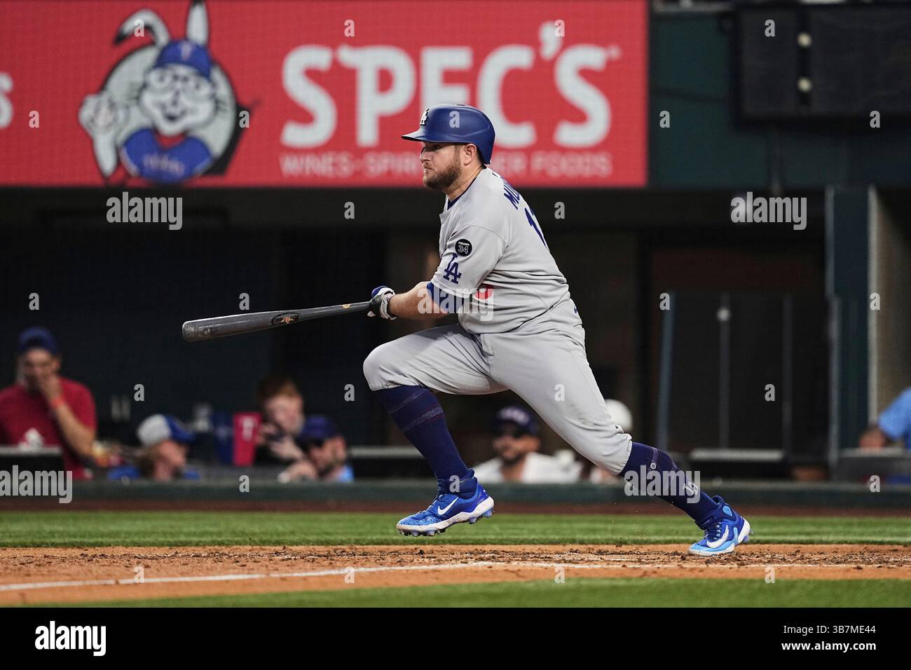 Los Angeles Dodgers' Max Muncy follows through on a swing during a ...