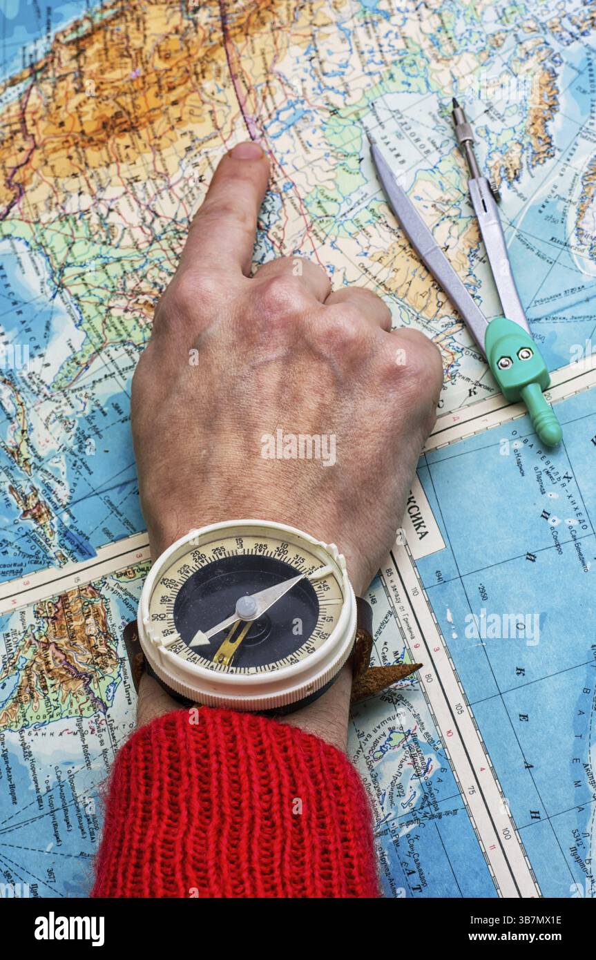 Hand to indicate the route on topographic map Stock Photo - Alamy