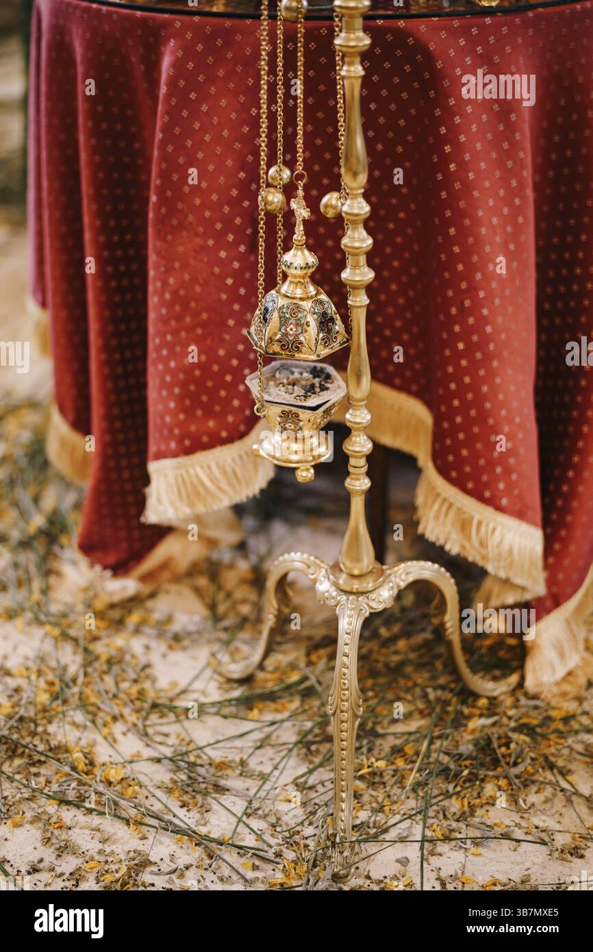 Smoking censer hangs on a gold stand in a church Stock Photo - Alamy