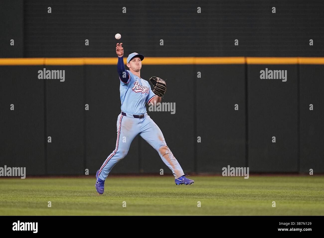 Texas Rangers left fielder Wyatt Langford throws the ball in during a ...