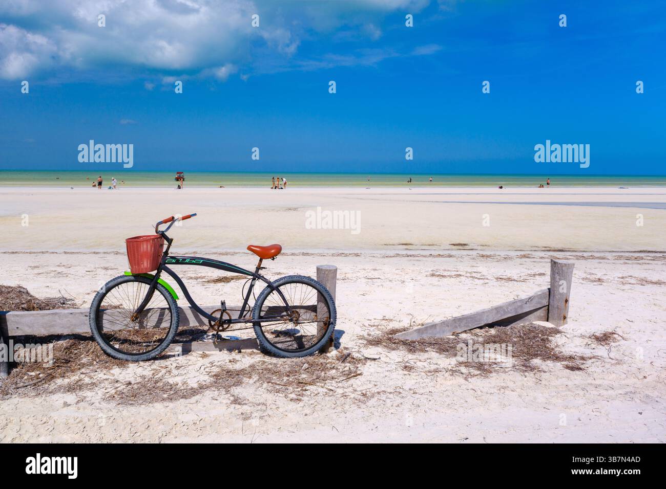 Holbox, Mexico – 10 February 2025: A classic cruiser bicycle with a red ...