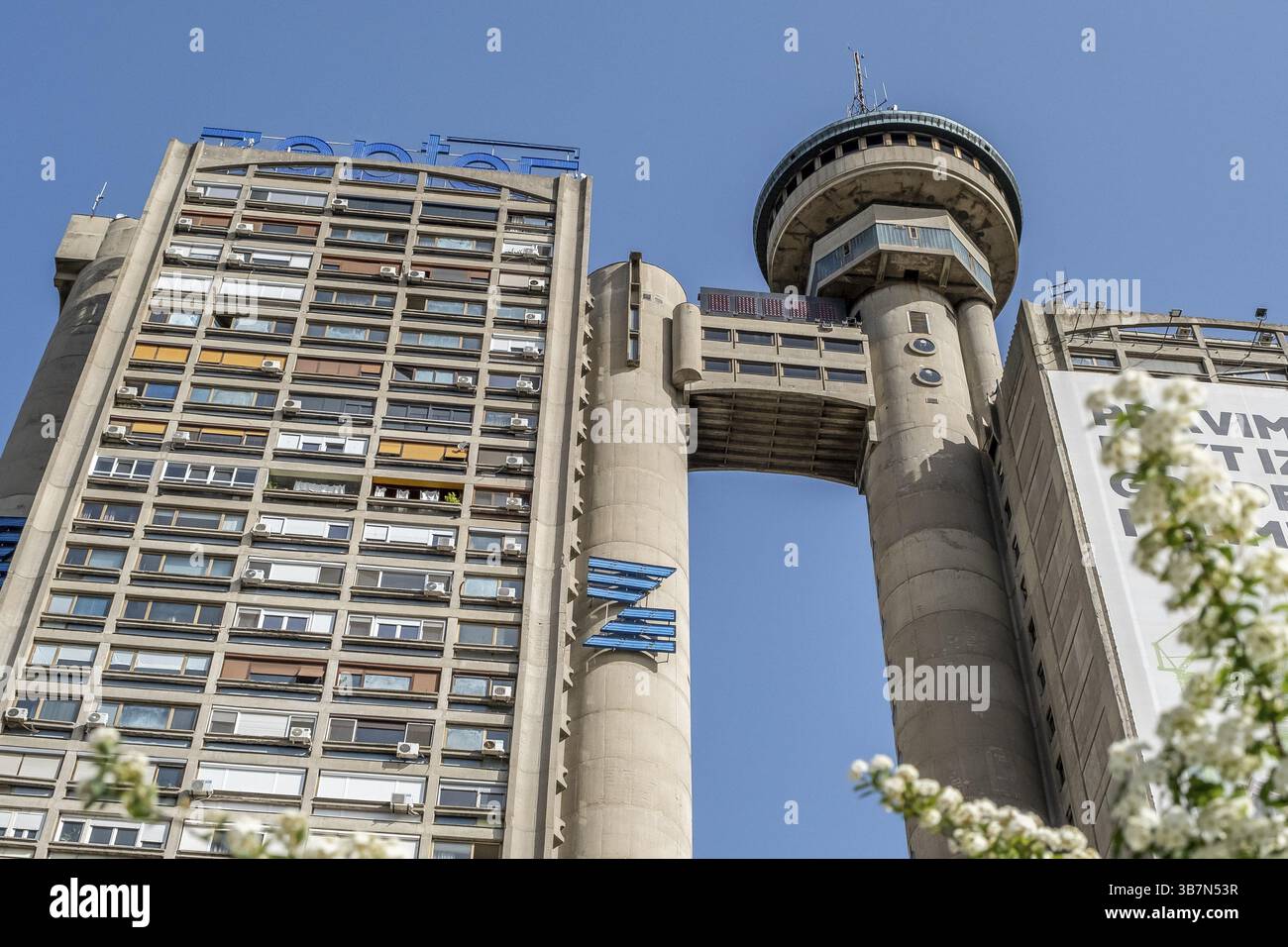 Genex Tower in Belgrade, brutalist architecture under a blue sky Stock ...