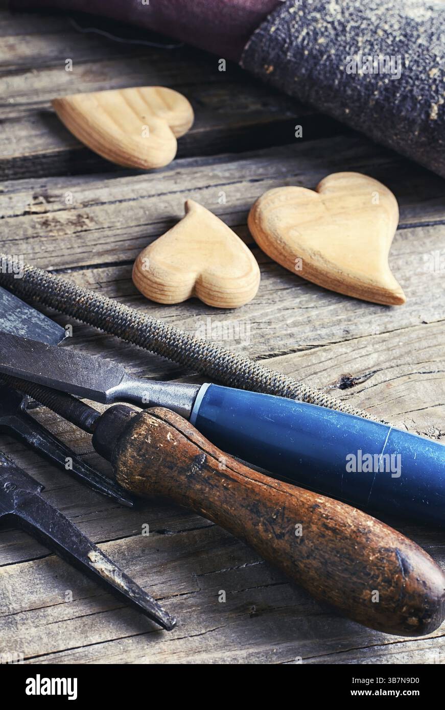 Symbolic wooden hearts cut by hand and carpenter tools Stock Photo - Alamy