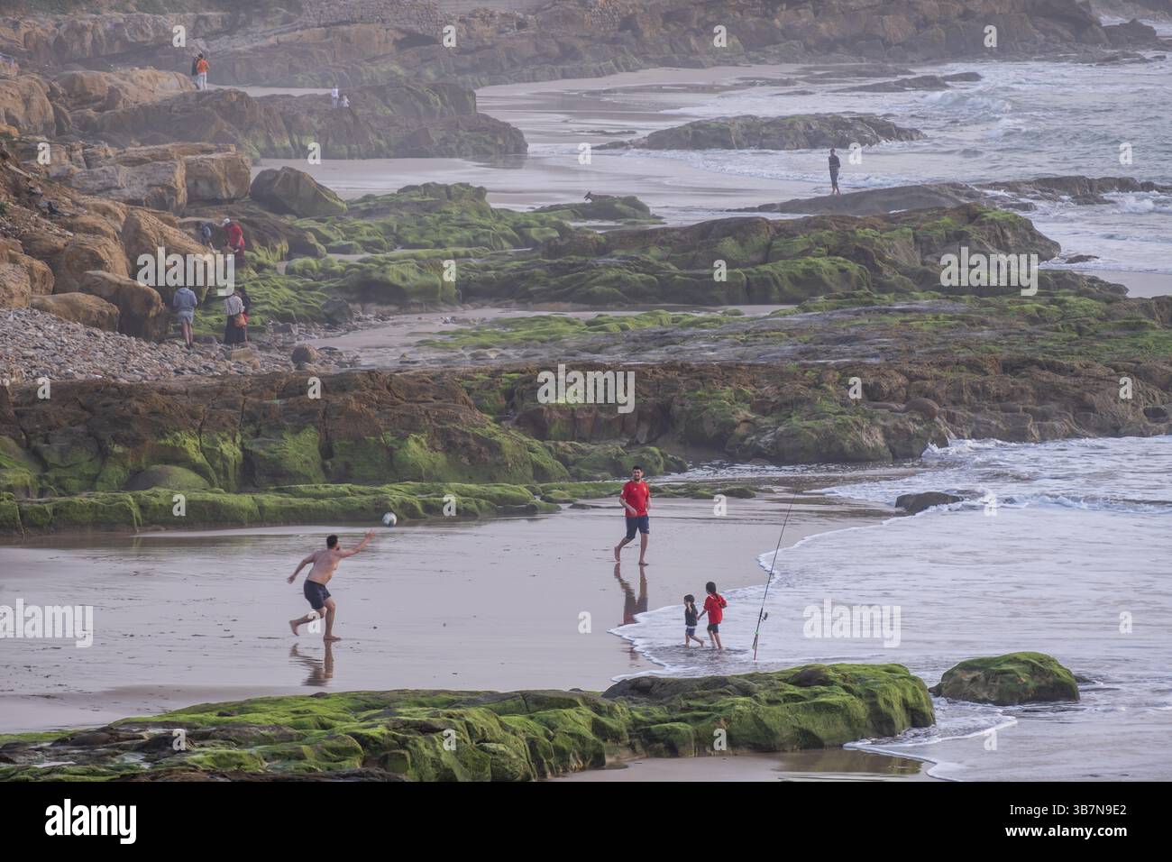 Games on the beach during the tide, Asilah, morocco Stock Photo - Alamy
