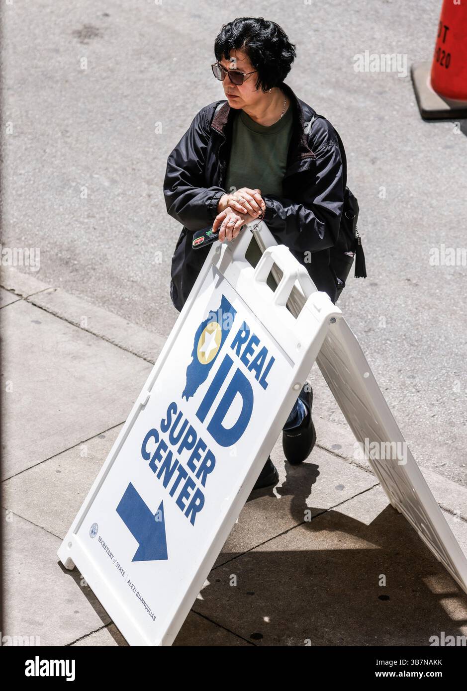 Chicago, United States. 11th Apr, 2025. A woman stands outside the ...