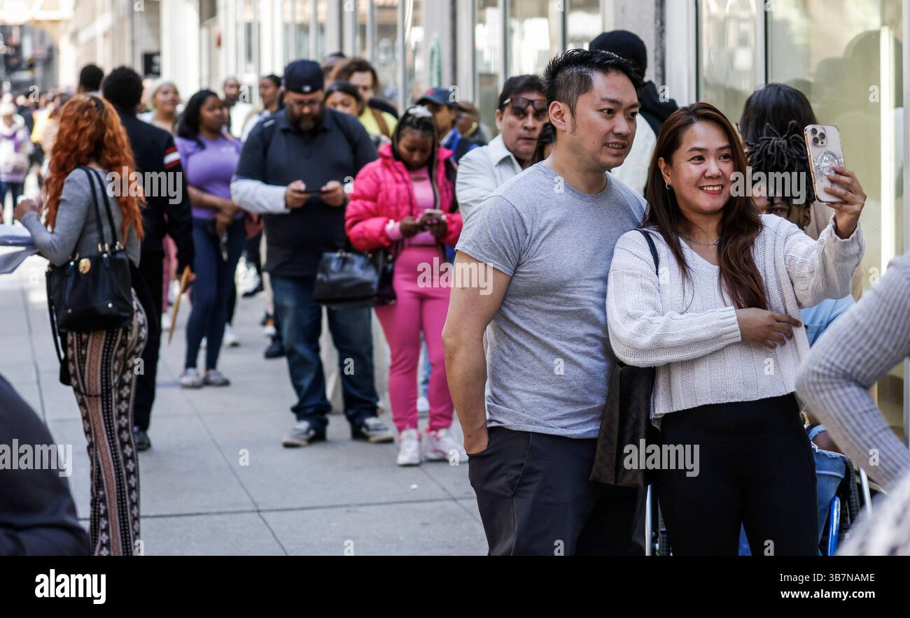 Chicago, United States. 11th Apr, 2025. A couple poses for a selfie ...