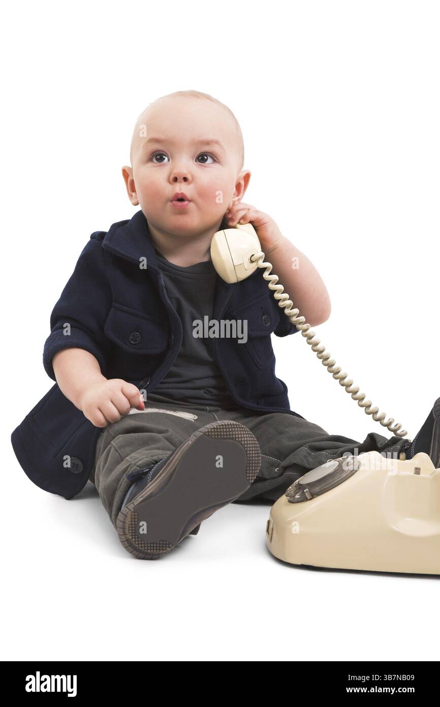 Funny boy with old phone Stock Photo - Alamy