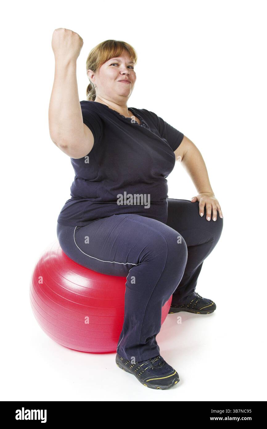 Fat woman with big red gimnastic ball Stock Photo - Alamy