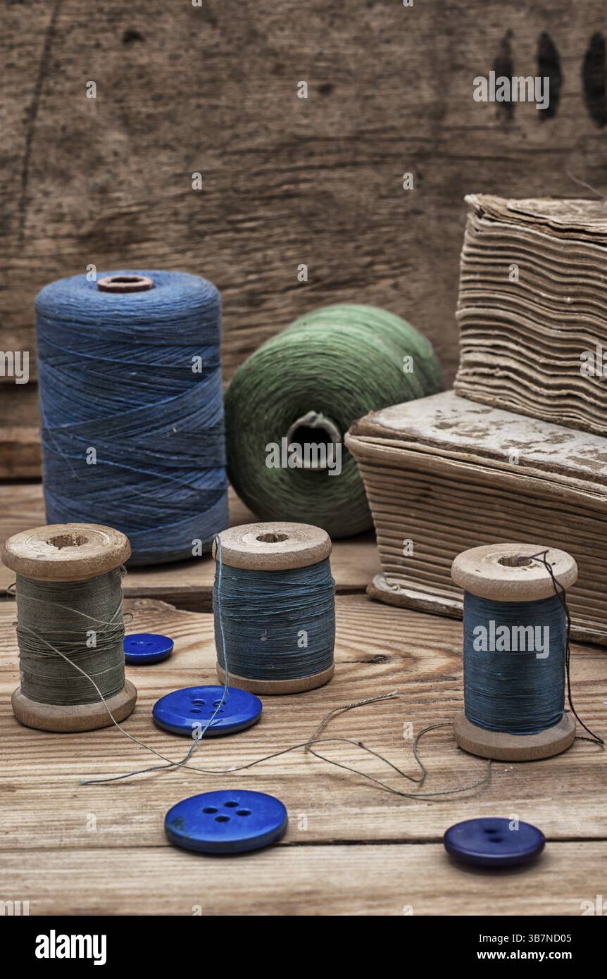 Spool sewing thread and buttons in vintage style Stock Photo - Alamy