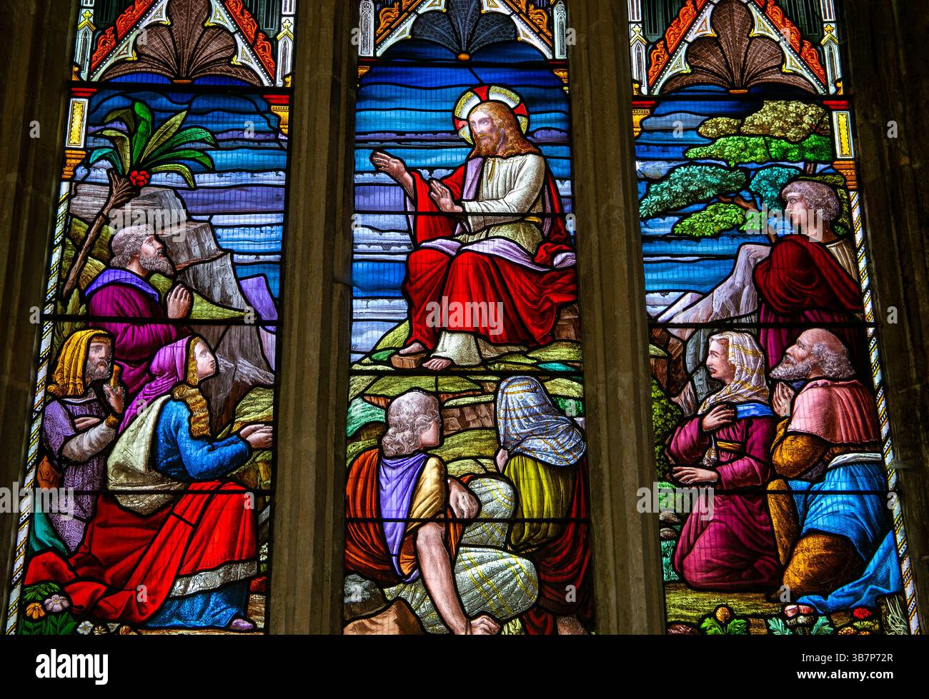 Stained glass window depicting Jesus Christ teaching surrounded by ...