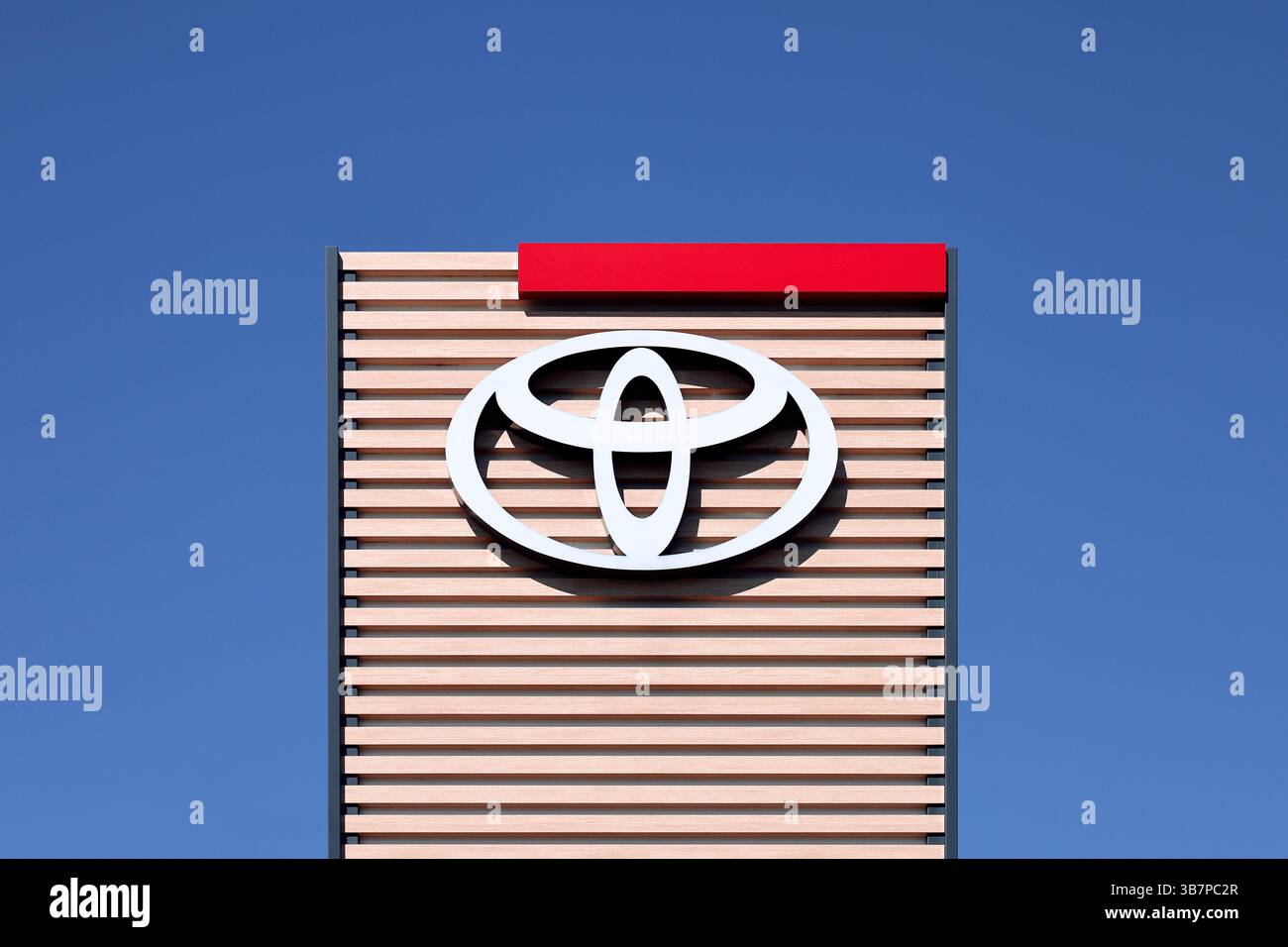 Toyota logo on a pylon at a car dealership - Toyota is the largest ...