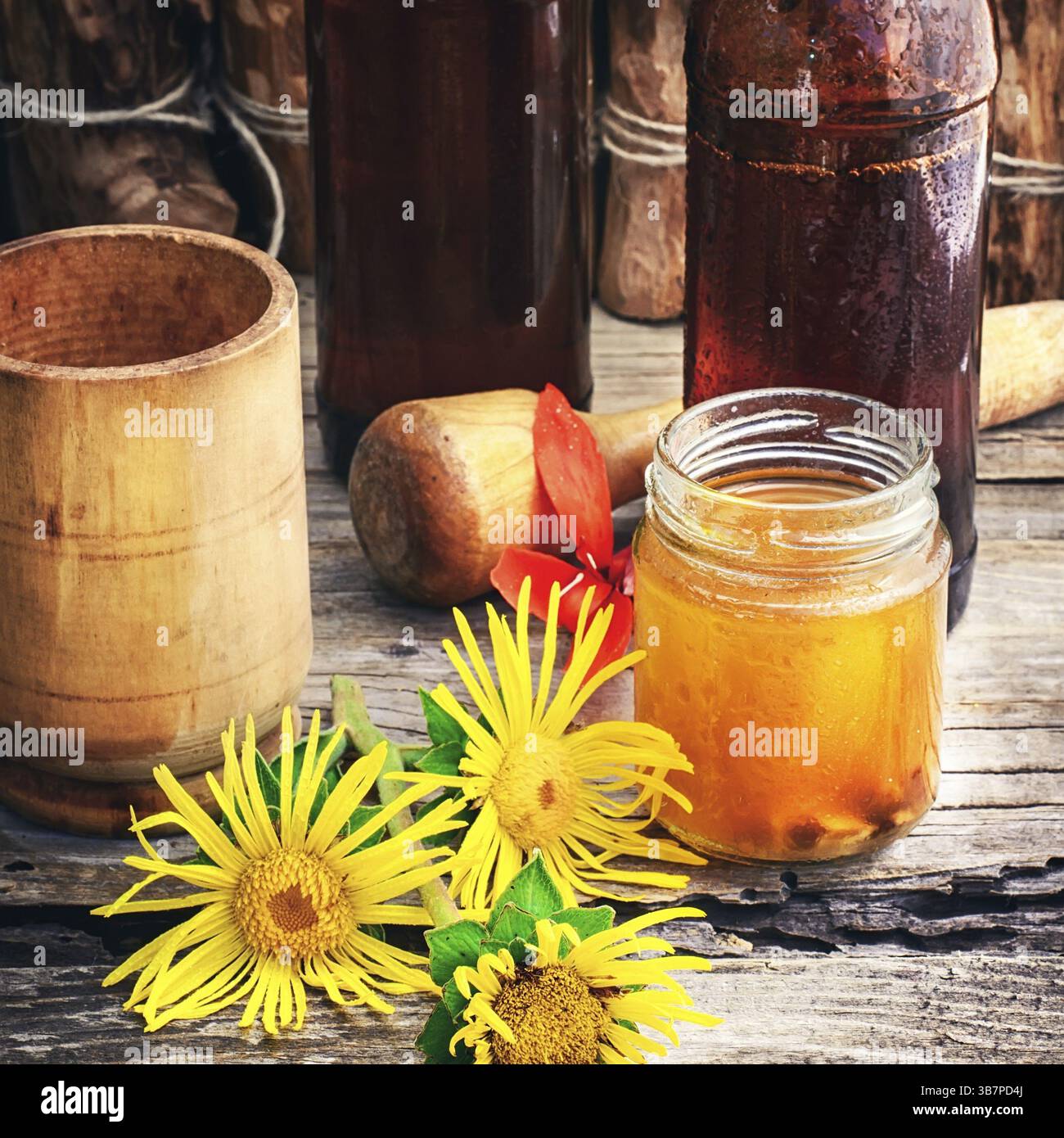 Medicinal folk remedy tincture from the roots of inula Stock Photo - Alamy