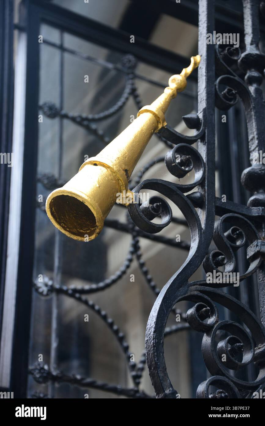 A Gold Flame Snuffer Outside a House in Mayfair Stock Photo - Alamy