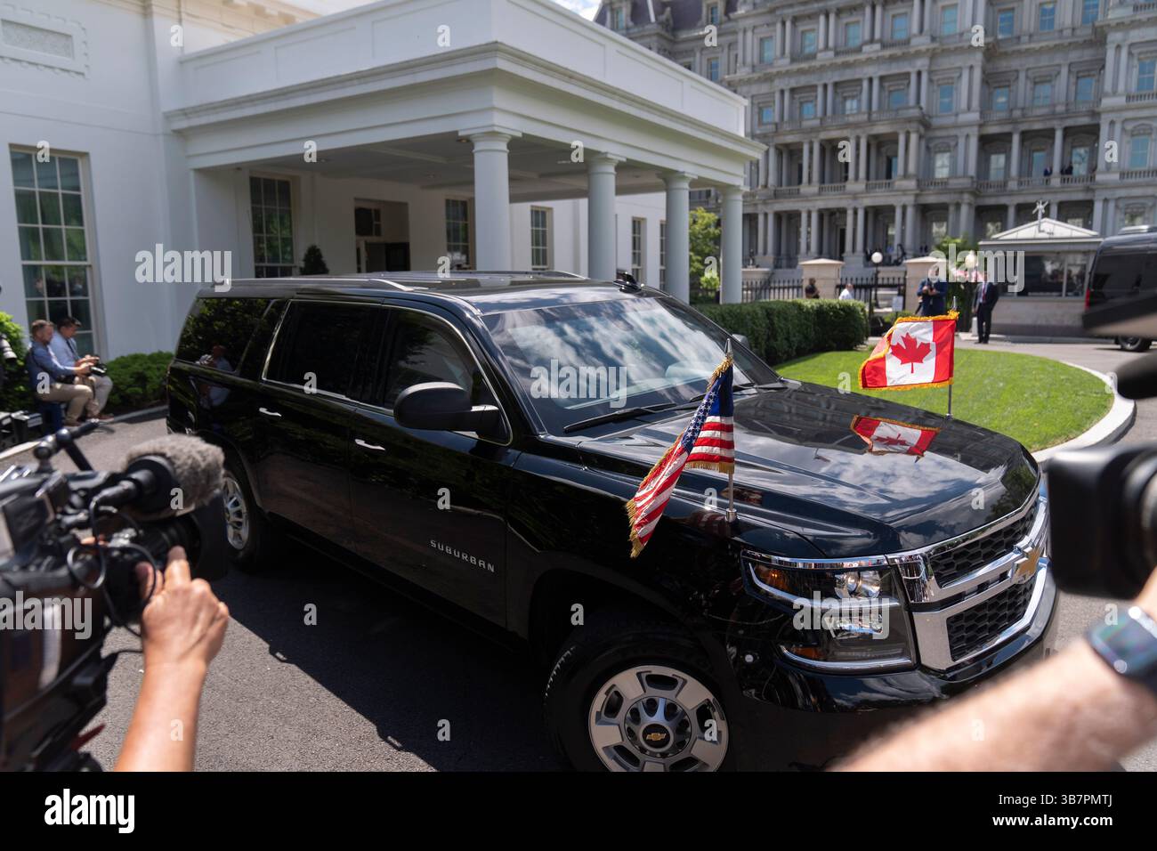 A vehicle carrying Canadian Prime Minister Mark Carney leaves the White ...