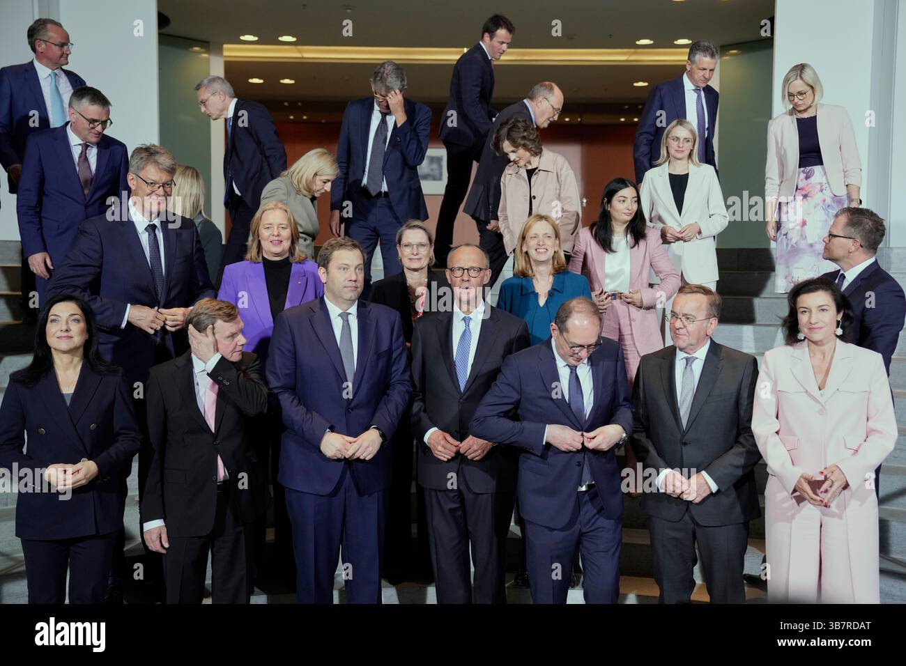 Newly-elected German Chancellor Friedrich Merz, center, and members of ...