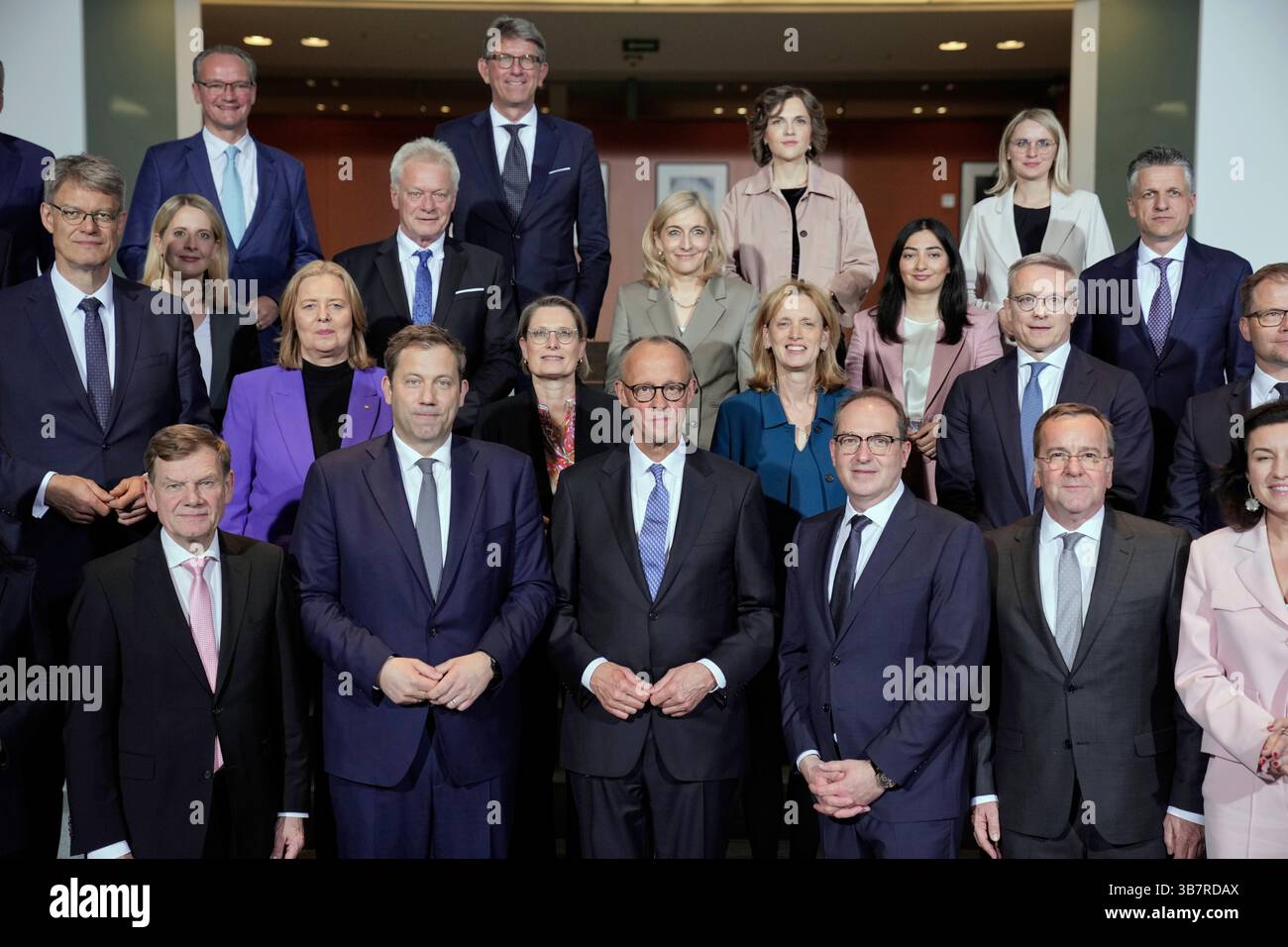 Newly-elected German Chancellor Friedrich Merz, center, and members of ...