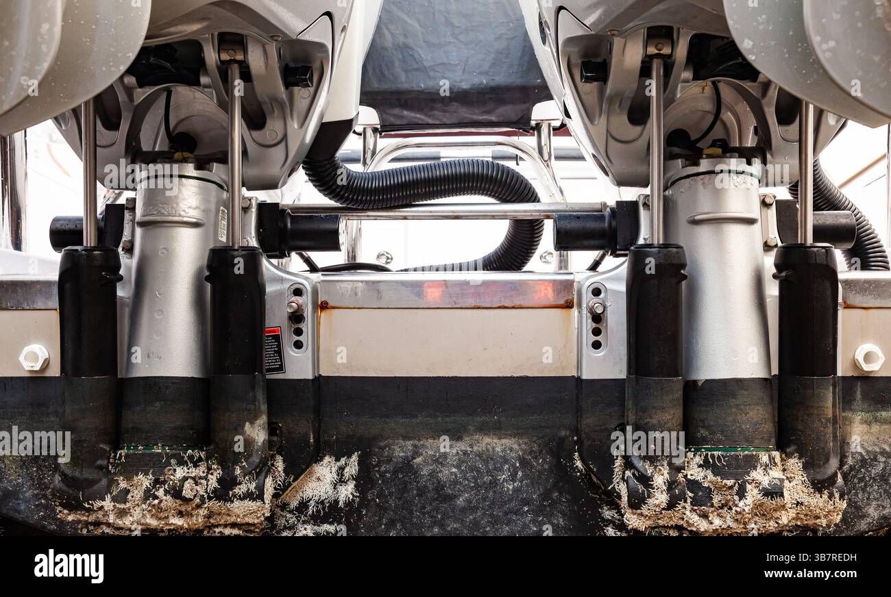 Lifting mechanisms on outboard motors at the stern of the boat. Transom ...