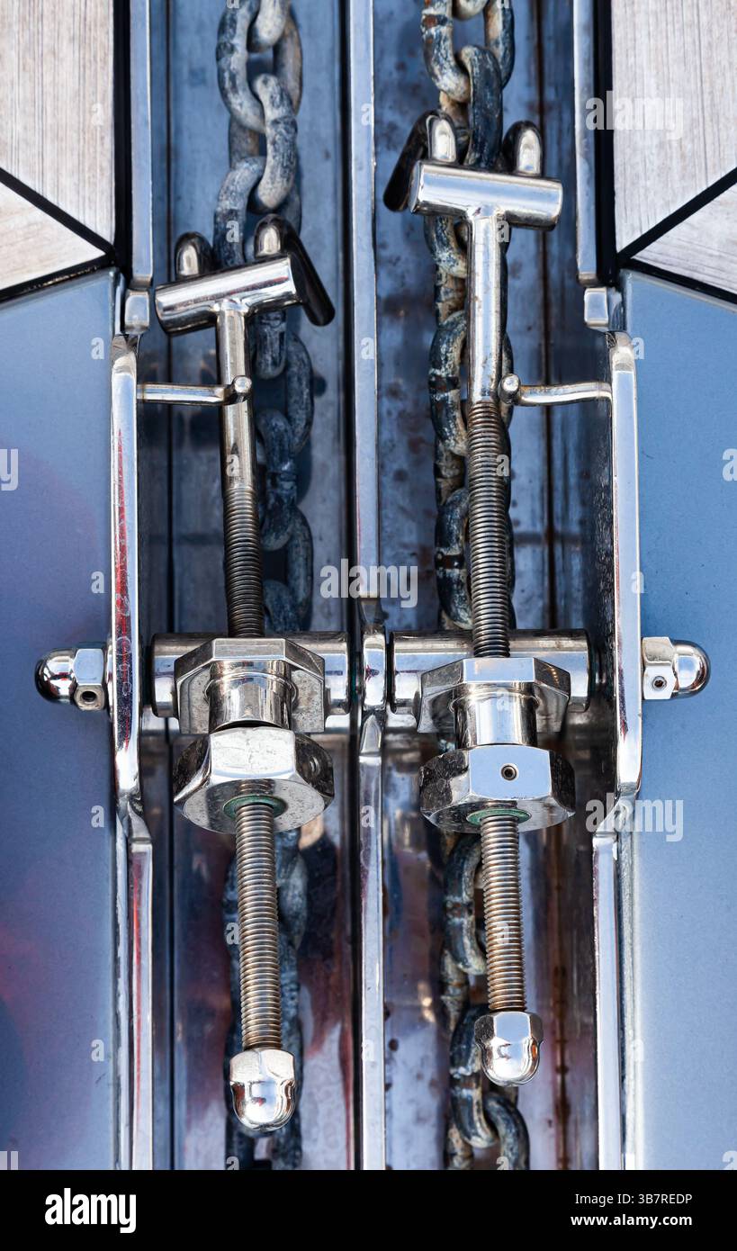 Clamps with stoppers for anchor chain on the deck of the yacht Stock ...