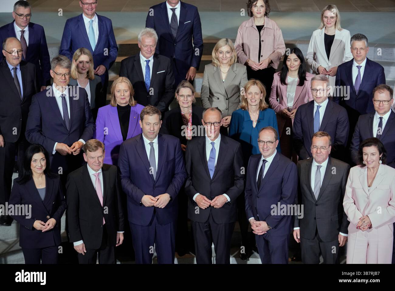 Newly-elected German Chancellor Friedrich Merz, center, and members of ...