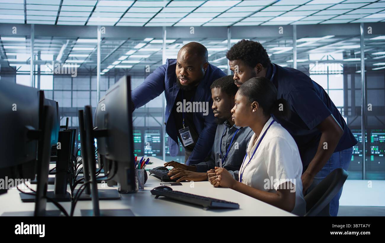 Coworkers in data center doing brainstorming, implementing AI predictive maintenance systems ...