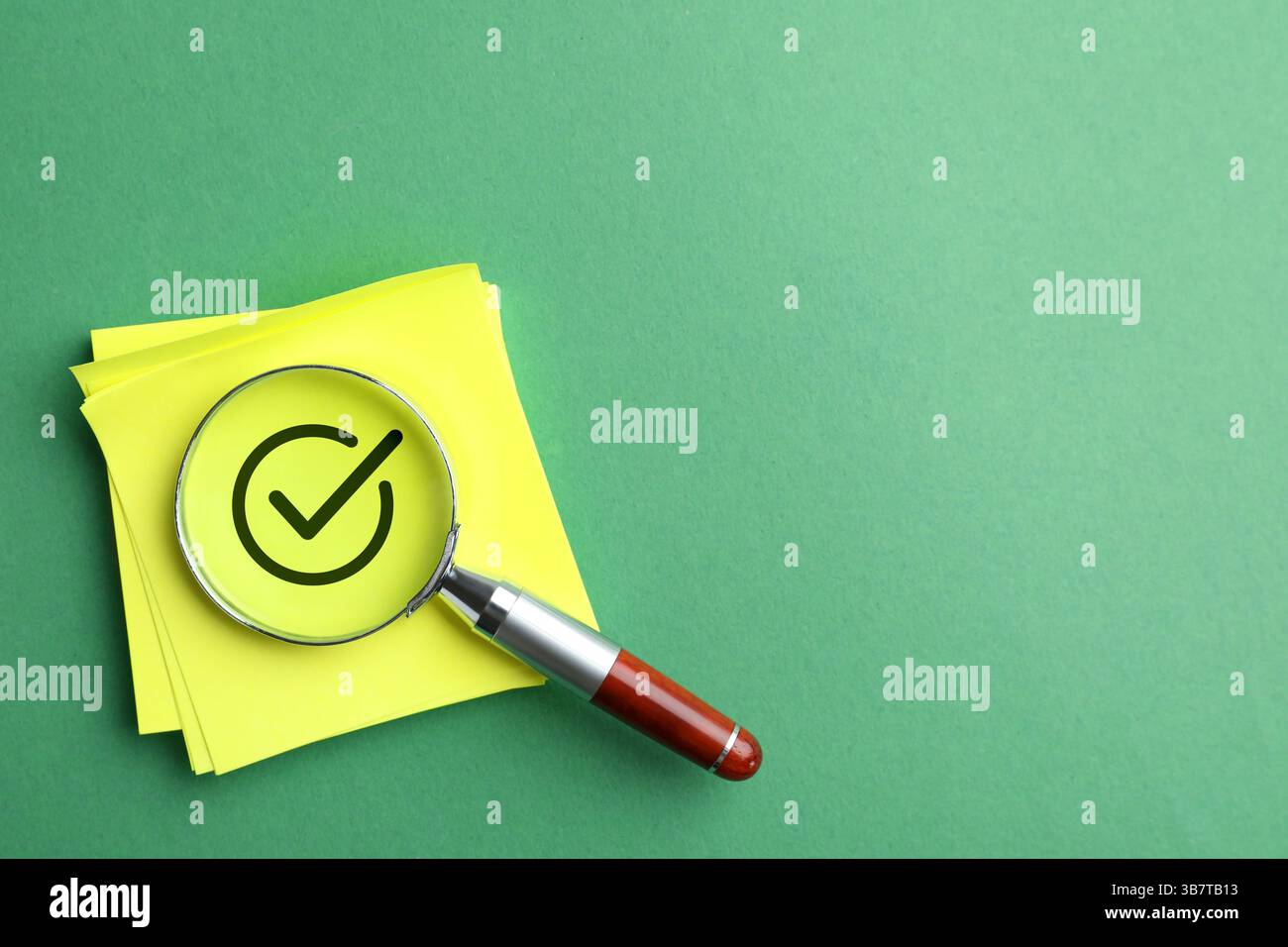 Approved. Yellow paper note with check mark and magnifying glass on ...