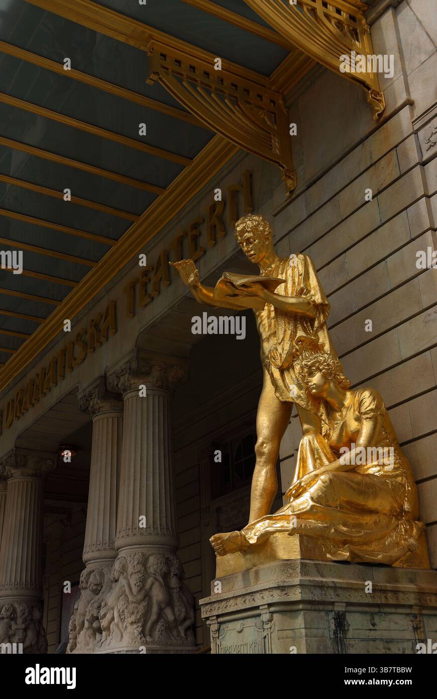 Sweden, Stockholm, Nybroplan. Golden Statues at the main entrance of ...