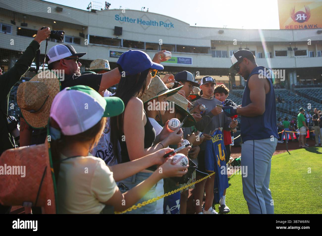 Seattle Mariners' Julio Rodríguez signs autographs for fans before a ...