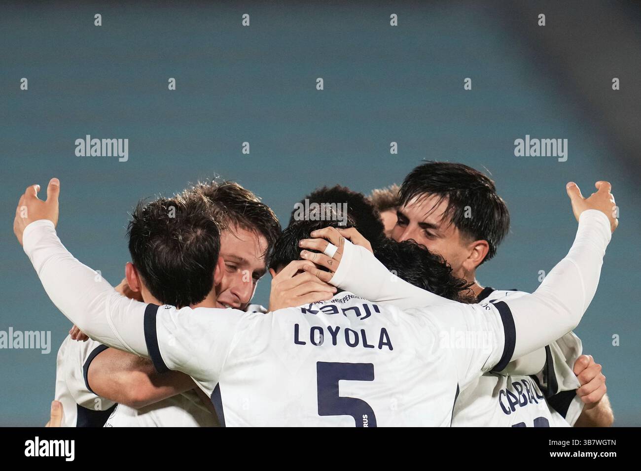 Felipe Loyola of Argentina's Independiente and teammates embrace Diego ...