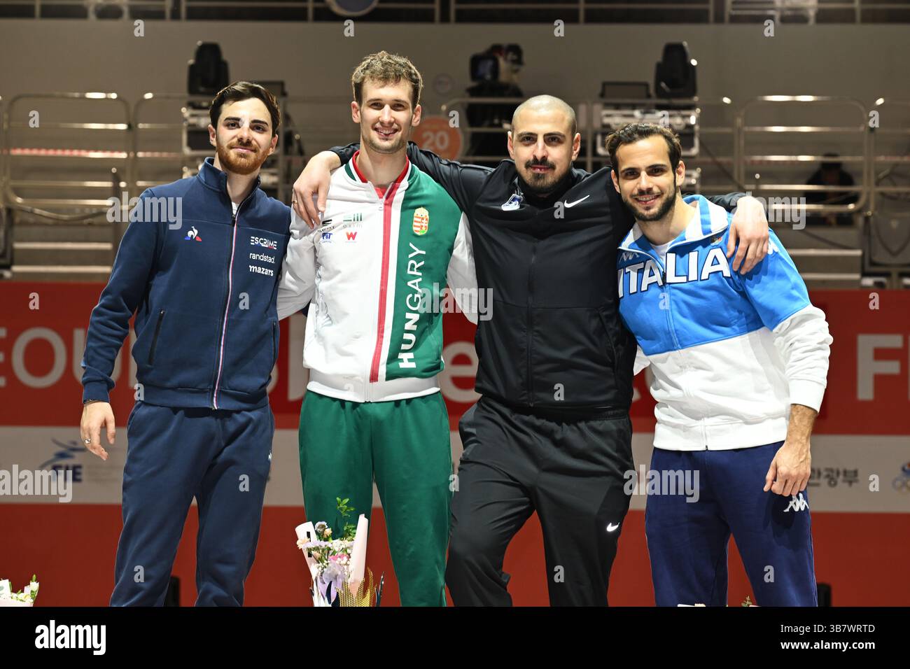 First place Hungarys Krisztian Rabb (2nd L) poses with second place ...