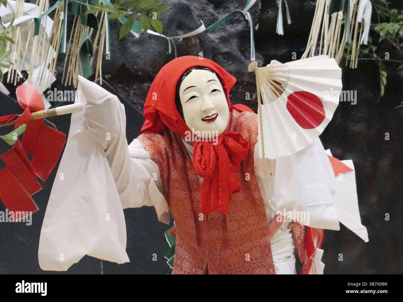 A "kagura" Shinto ritual ceremonial dance is performed in front of ...