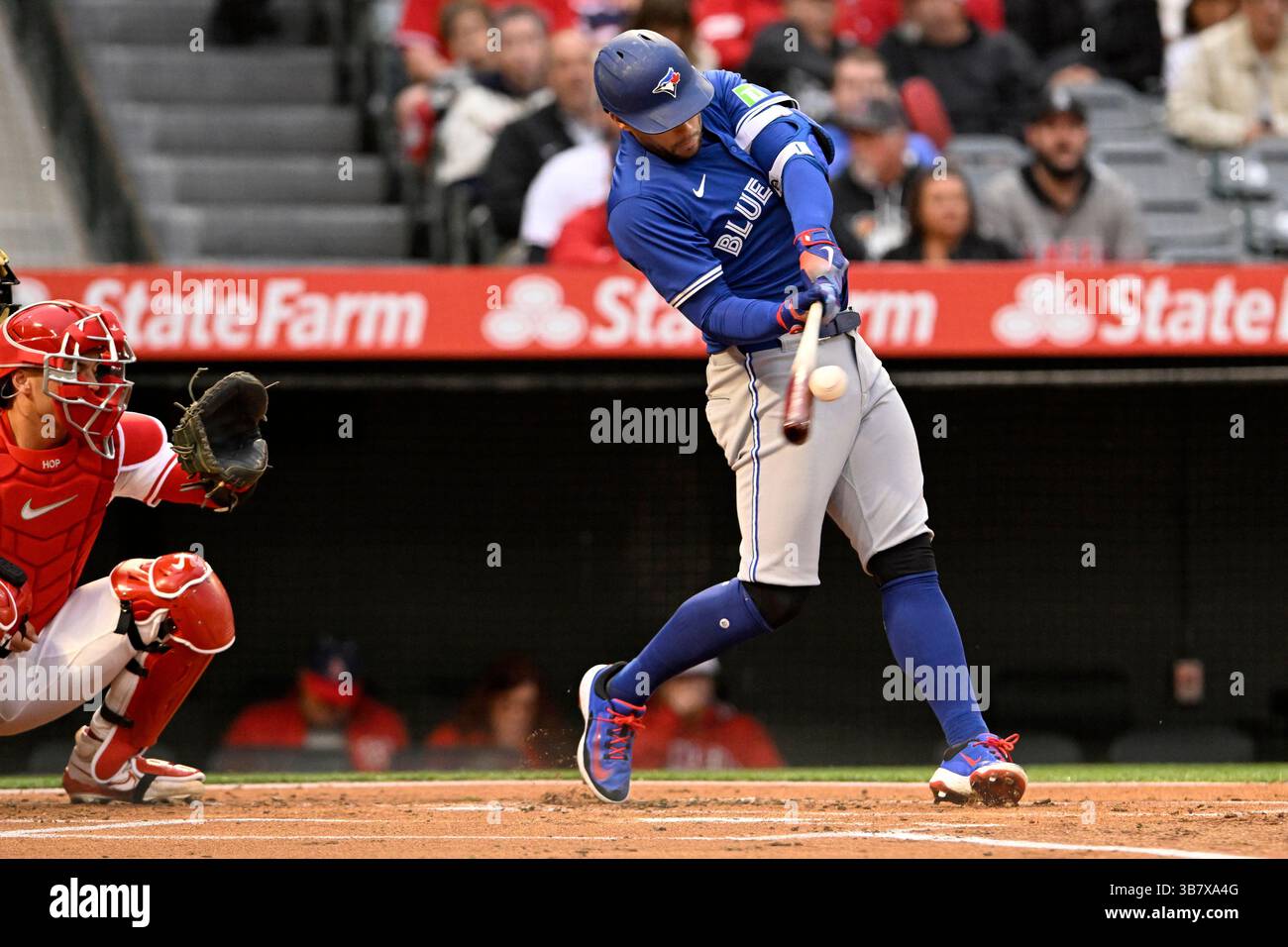 Toronto Blue Jays' George Springer, right, hits a two-run home run next ...