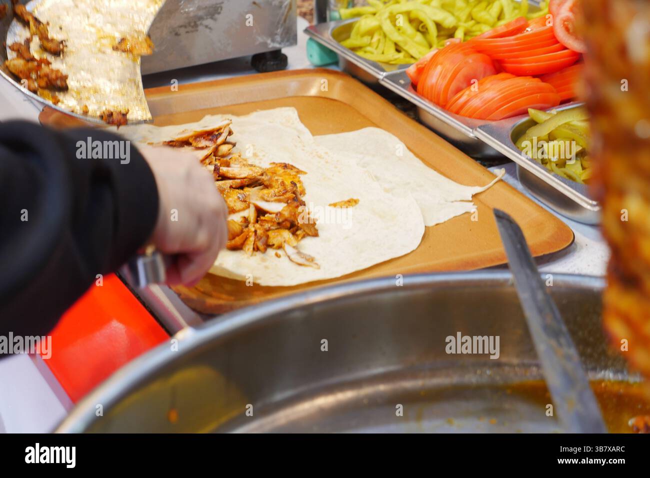 Making delicious shawarma wraps at a busy market stall Stock Photo - Alamy