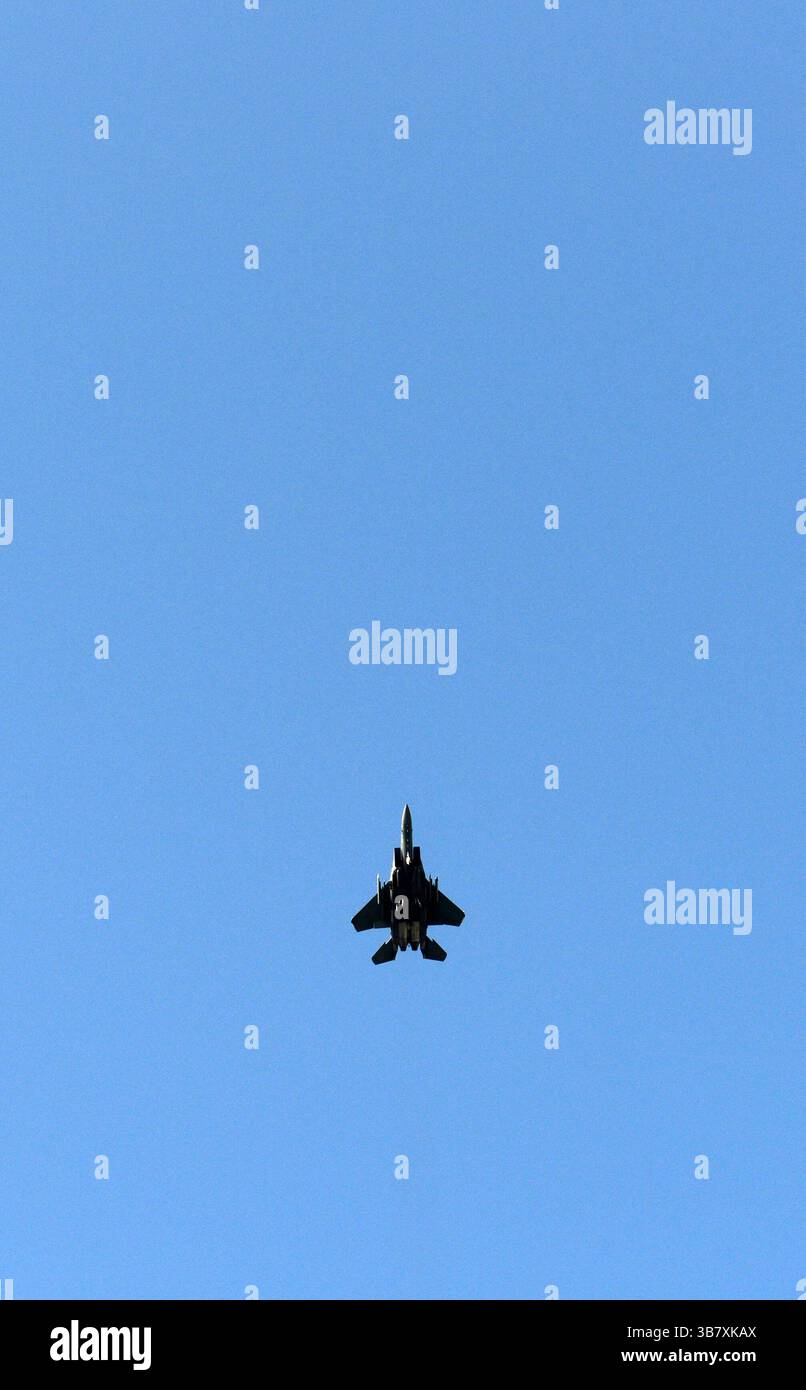 An American F-15 Eagle fighter Jet flying over Chatan, Okinawa, Japan ...