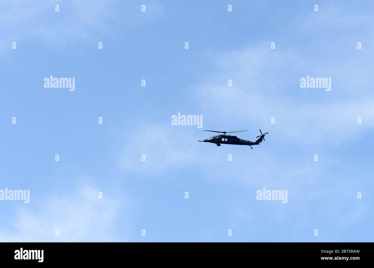 An American Airforce Black Hawk helicopter flying over Cape Zanpa ...