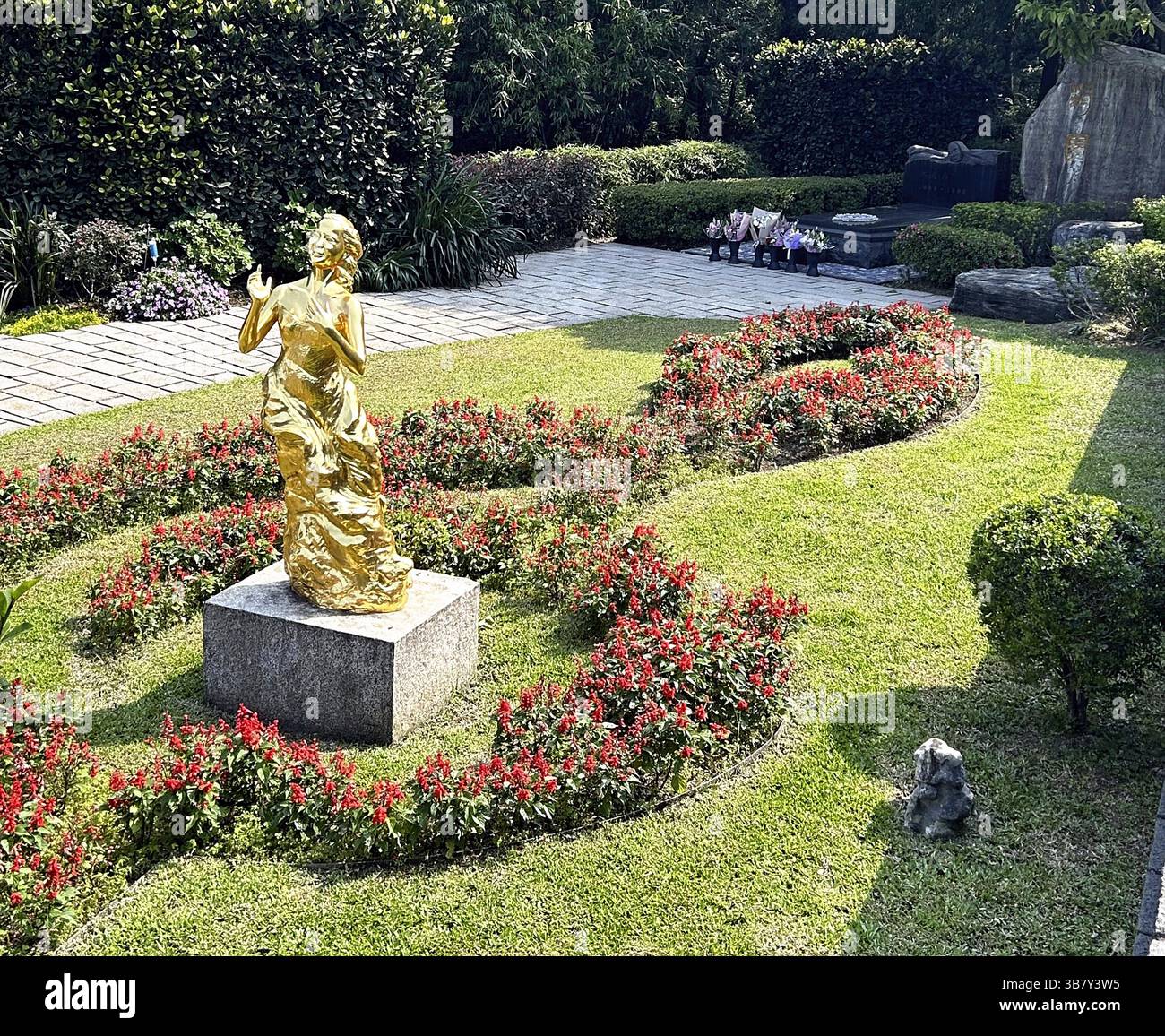 A photo shows Teresa Teng's bronze statue in the area where her grave ...