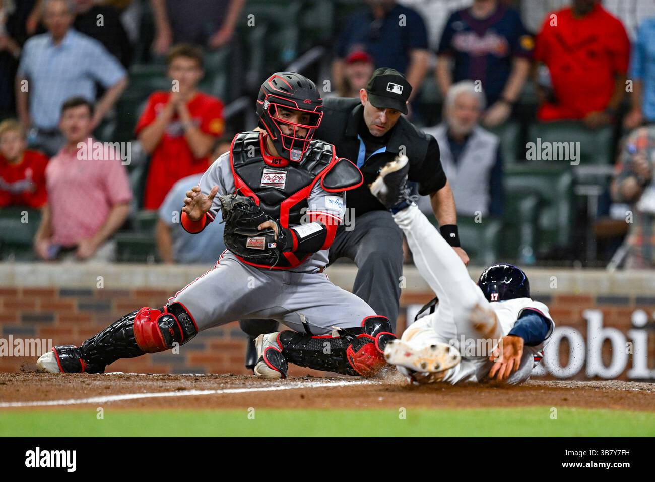 ATLANTA, GA – MAY 06: Atlanta pinch runner Stuart Fairchild (17) slides ...