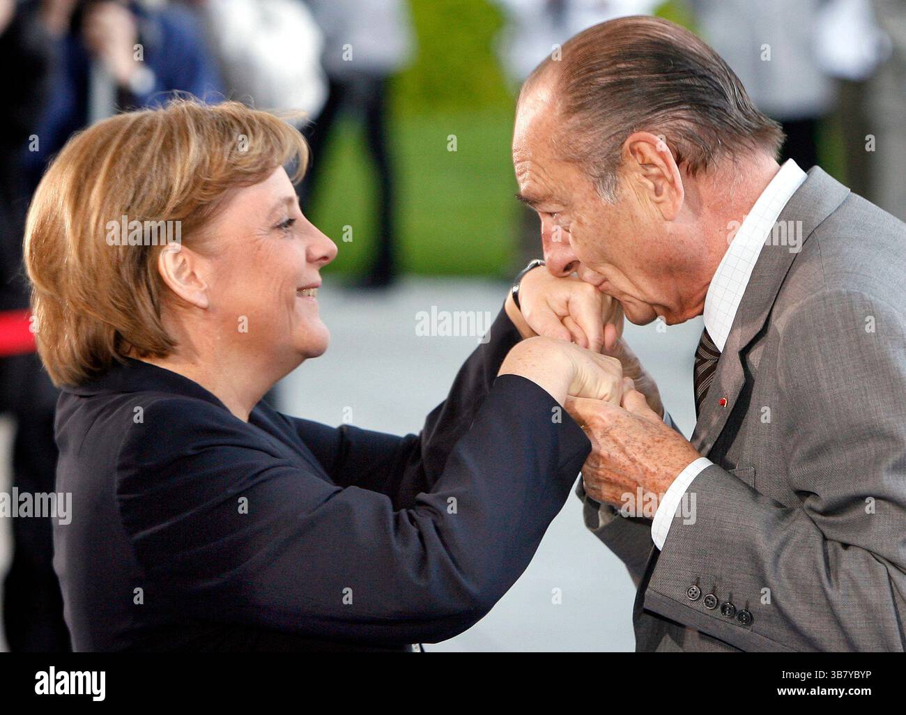 FILE - Chancellor Angela Merkel, left, welcomes French President ...